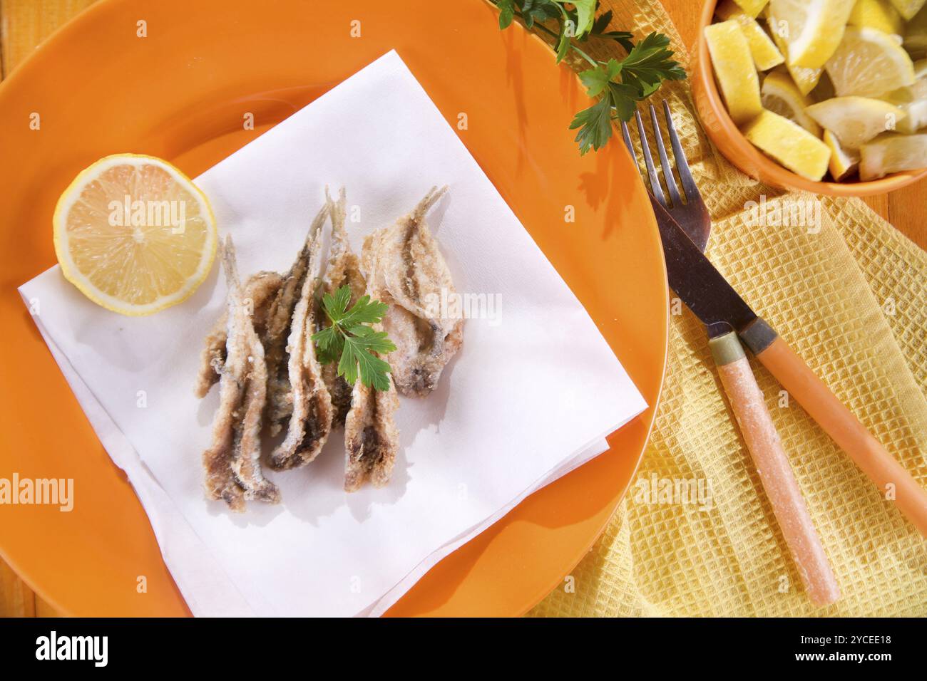 Presentation of a seafood platter, fried anchovies Stock Photo - Alamy