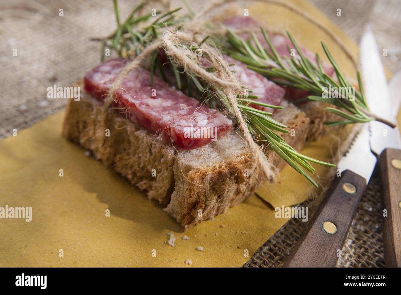Presentation of a snack of bread and salami Stock Photo - Alamy