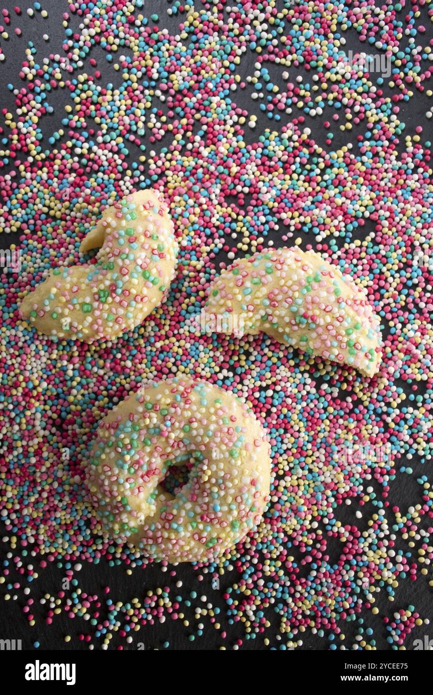 Prepared dry biscuits with sugar grains of different colors Stock Photo ...