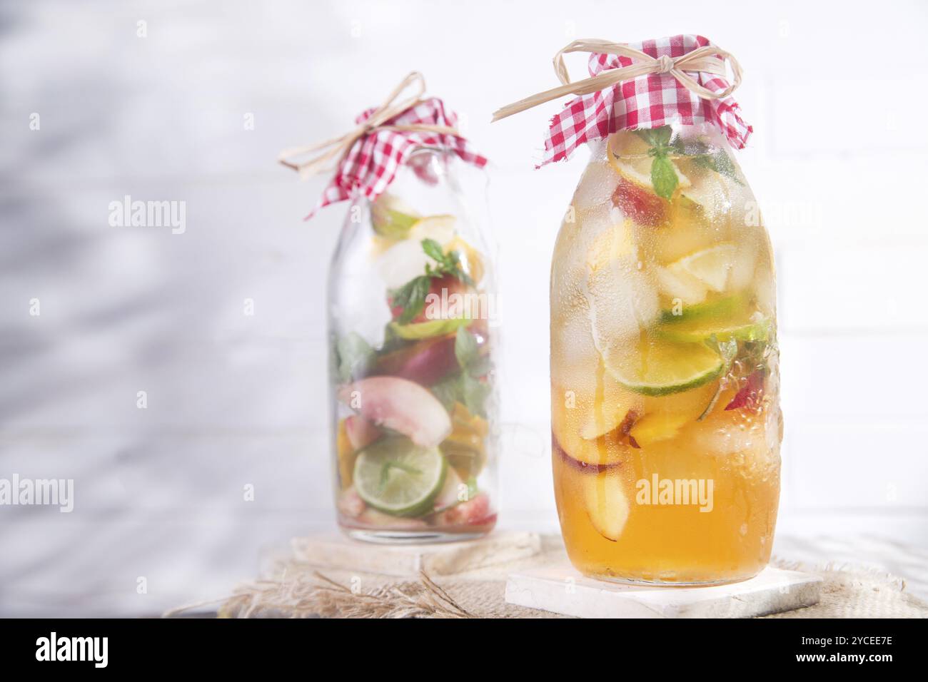 Bottle of infused fruit tea with peach and lemon Stock Photo - Alamy