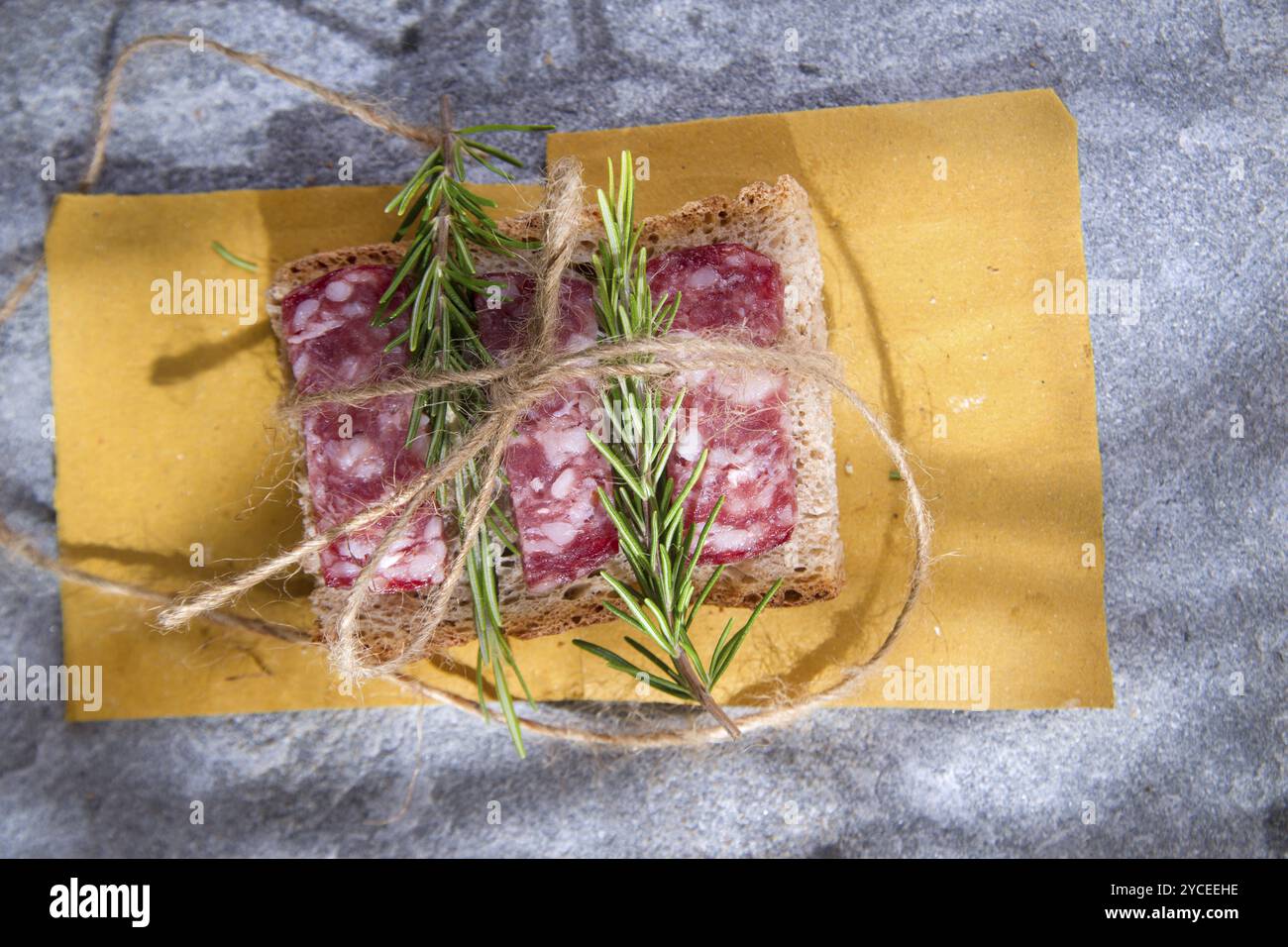 Presentation of a snack of bread and salami Stock Photo - Alamy