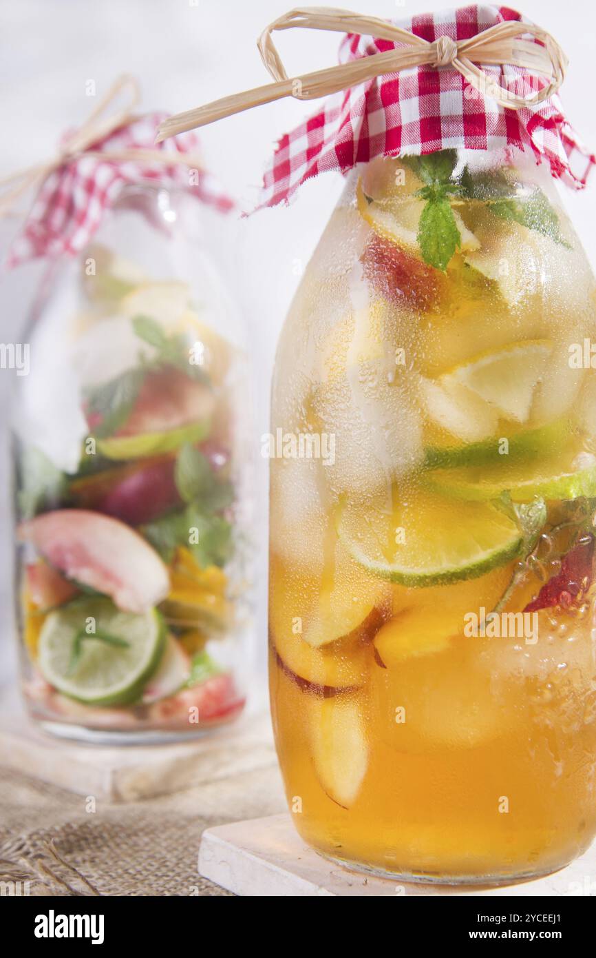 Bottle of infused fruit tea with peach and lemon Stock Photo - Alamy