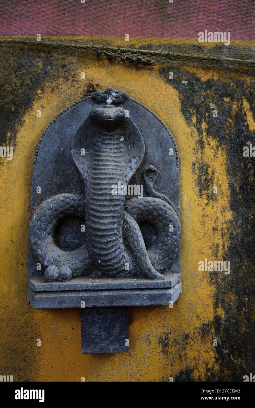 A little monument with cobra snake in Gokarna, Karnataka, Near some ...
