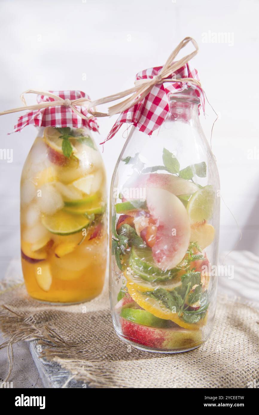 Bottle of infused fruit tea with peach and lemon Stock Photo - Alamy