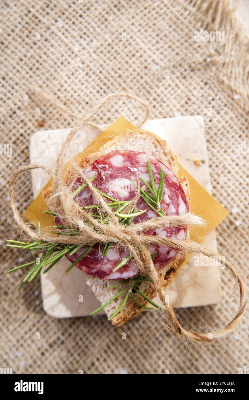 Presentation of a snack of bread and salami Stock Photo - Alamy