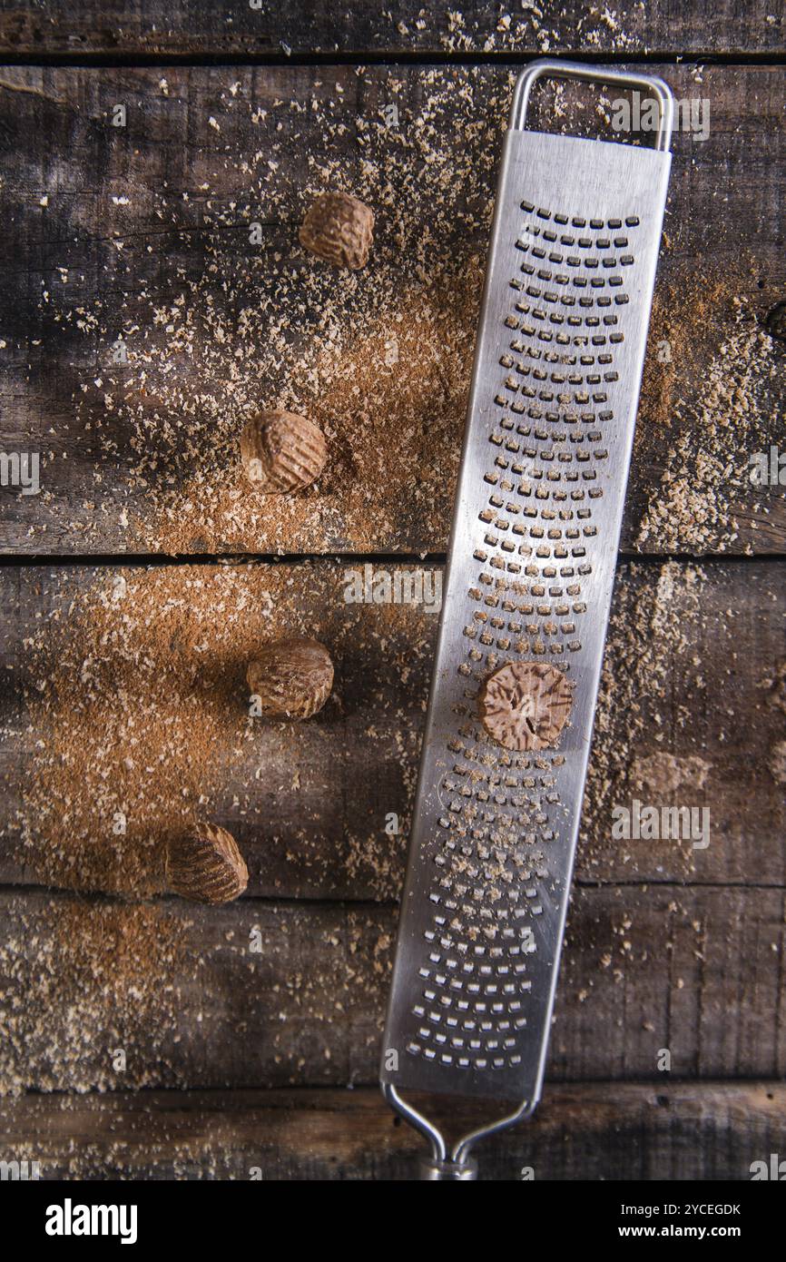 Detail of the grating of nutmeg flavor unique to particular foods and ...