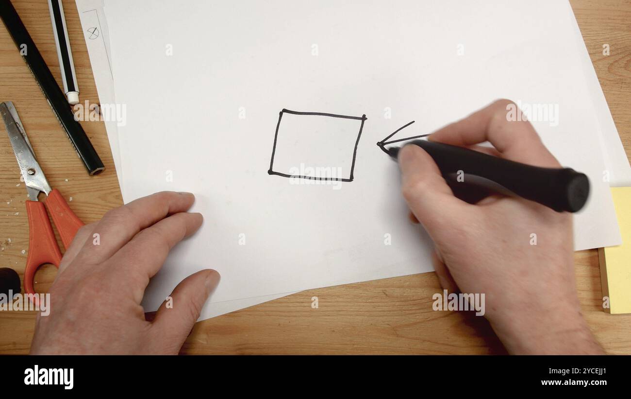 Top view, an architect's hand draws the square base for a house, ideal ...