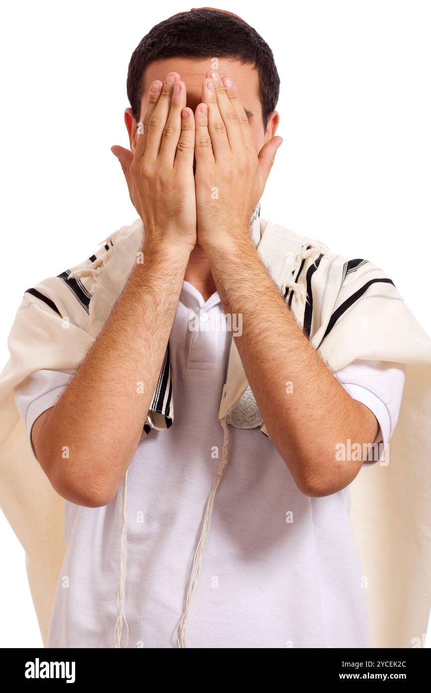 Jewish man closing face with his hands while praying Stock Photo - Alamy