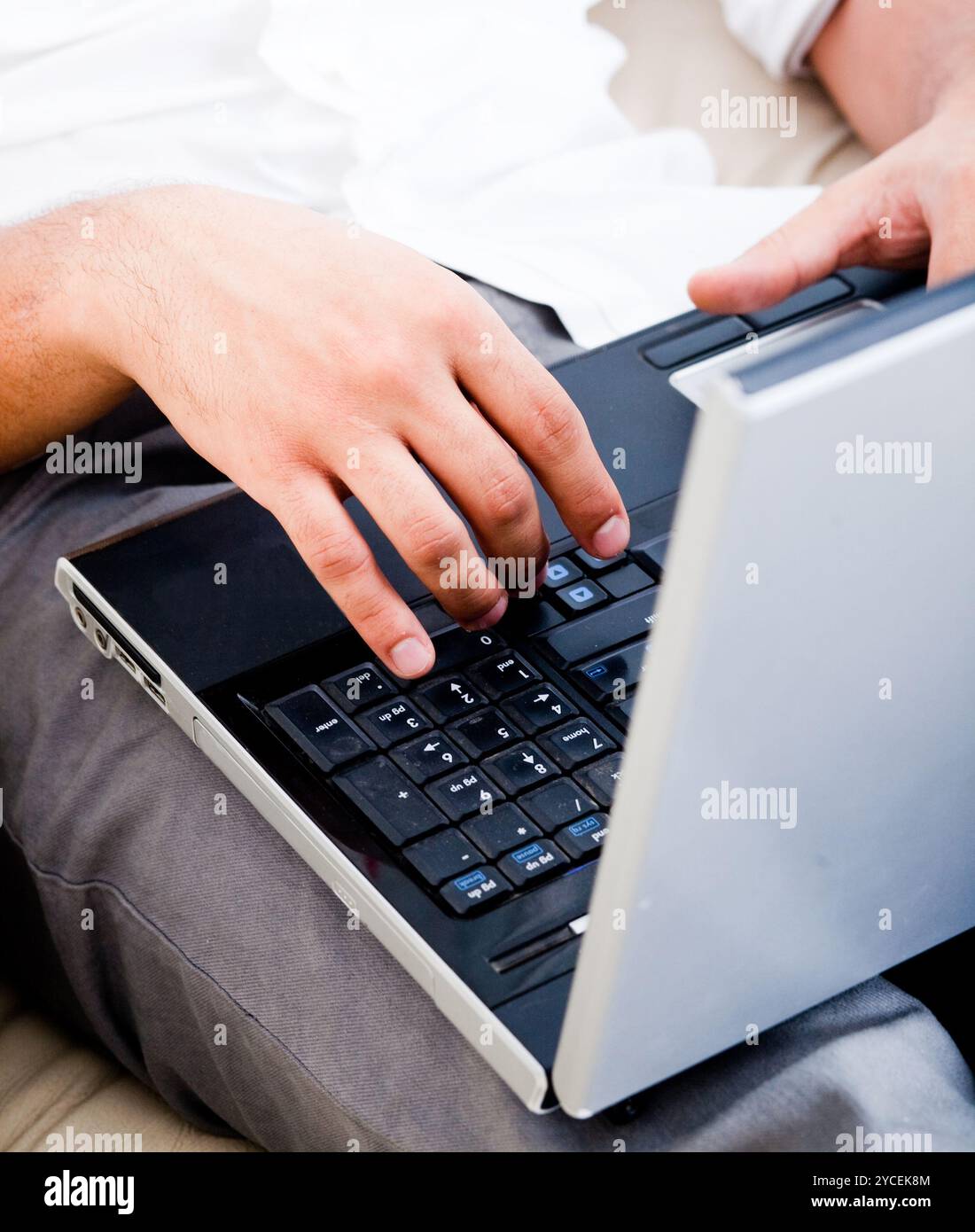 Isolated grey open laptop man typing Stock Photo - Alamy