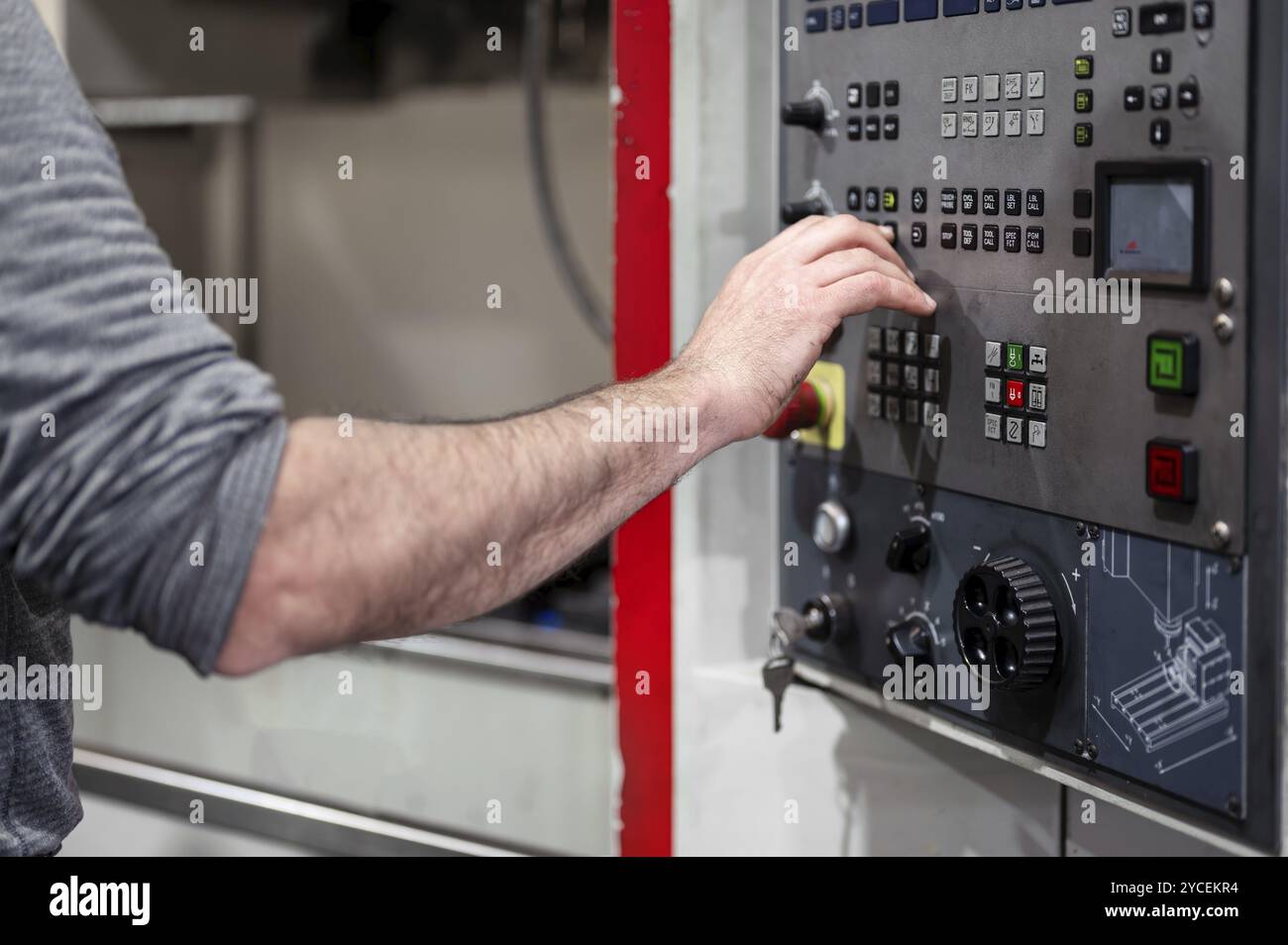 Machine operator presses buttons cnc hi-res stock photography and ...