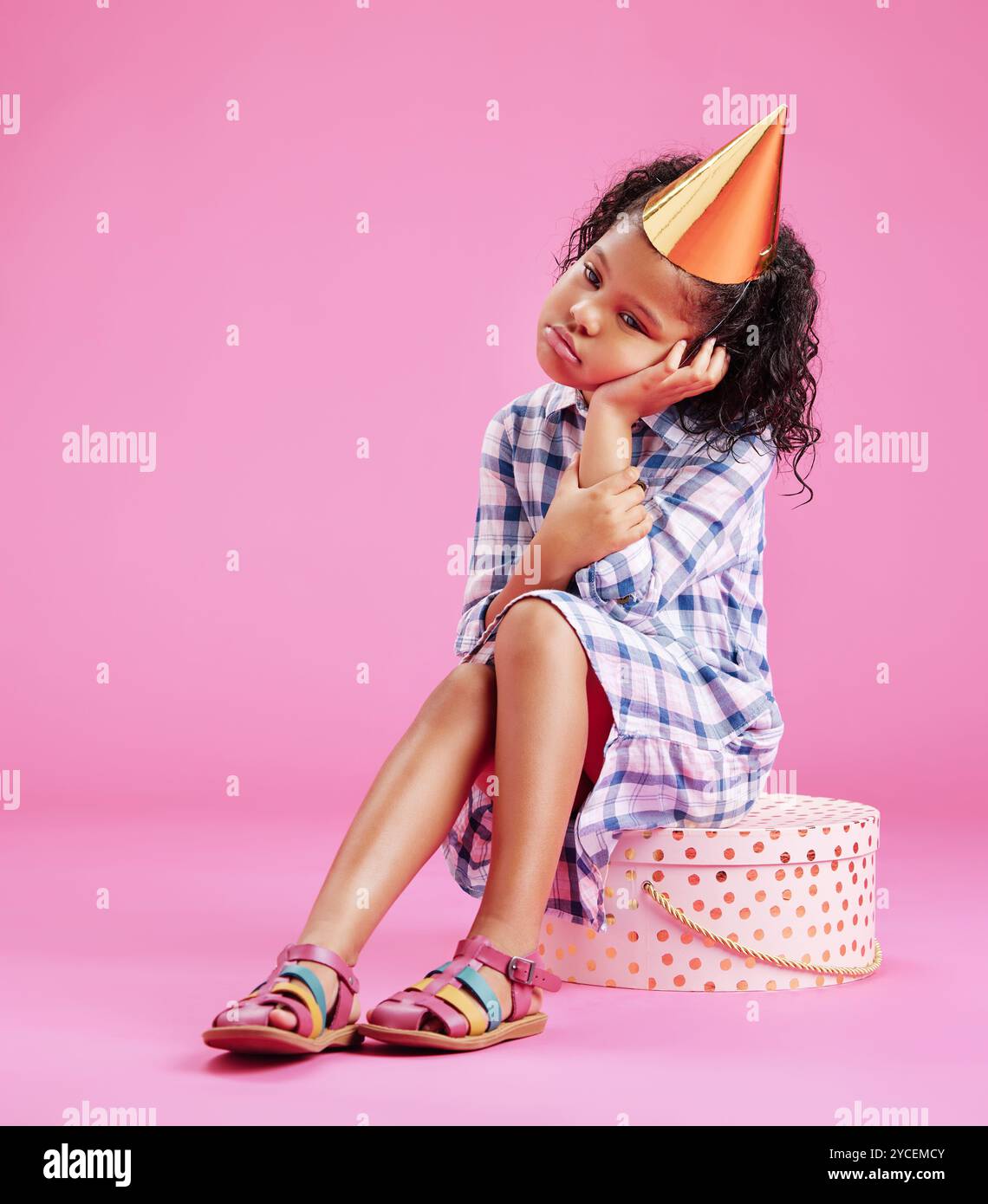 Studio, birthday party and bored girl child with sad face, fatigue and ...