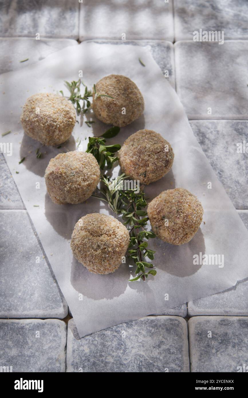 Preparation and presentation of raw meatballs Stock Photo - Alamy