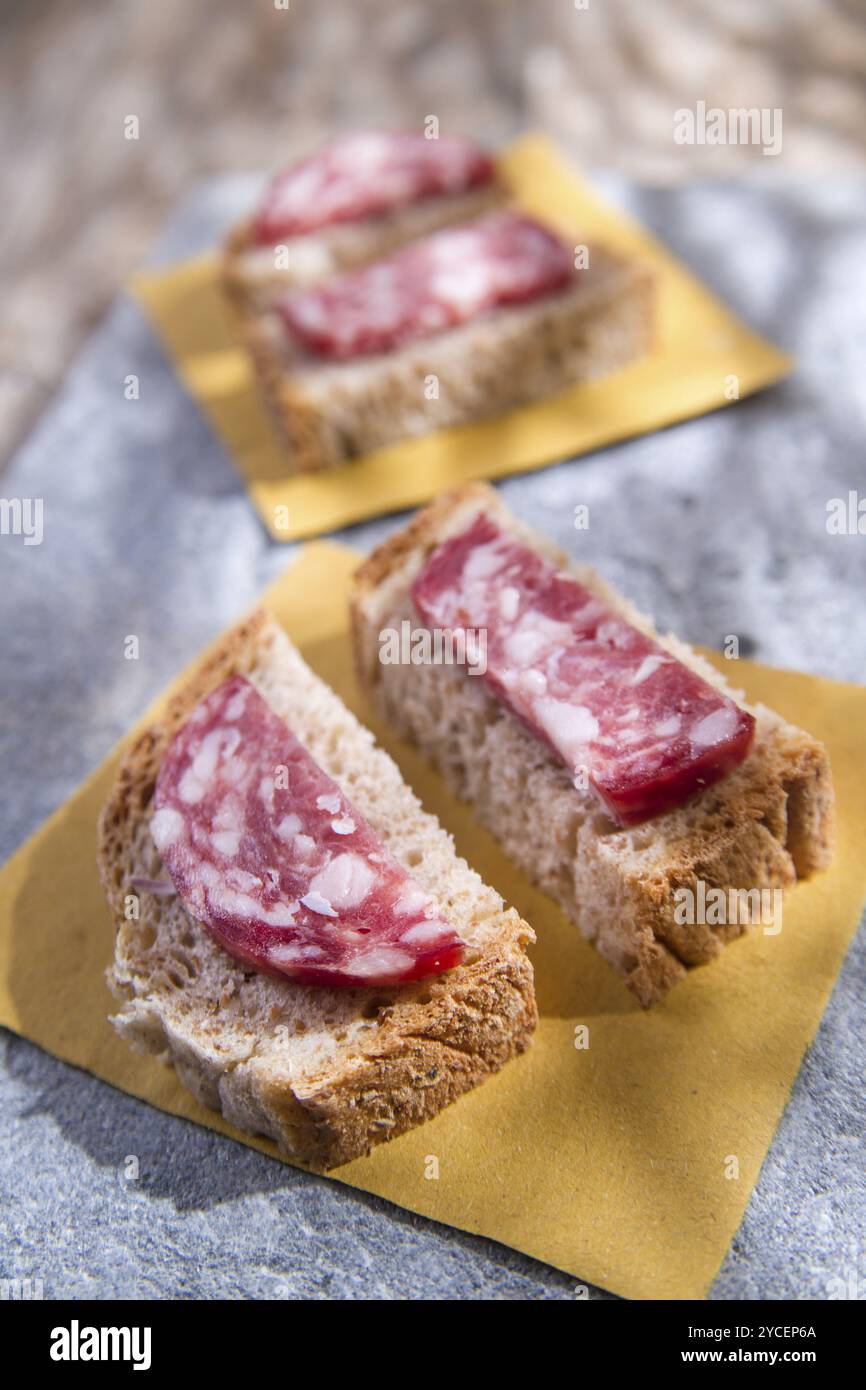 Presentation of a snack of bread and salami Stock Photo - Alamy