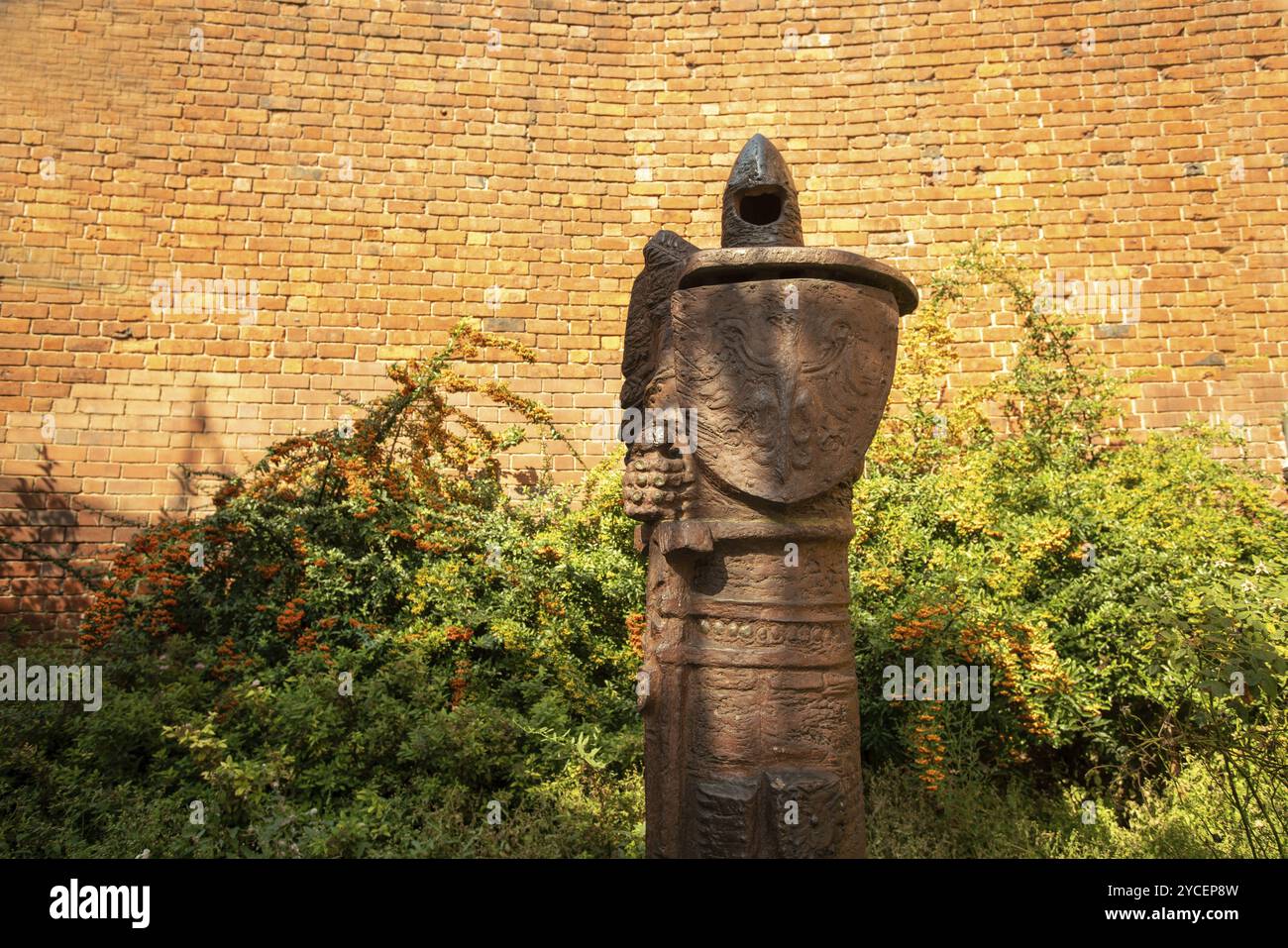 Medieval metal statue of knight in metal armor (without face) next to ...
