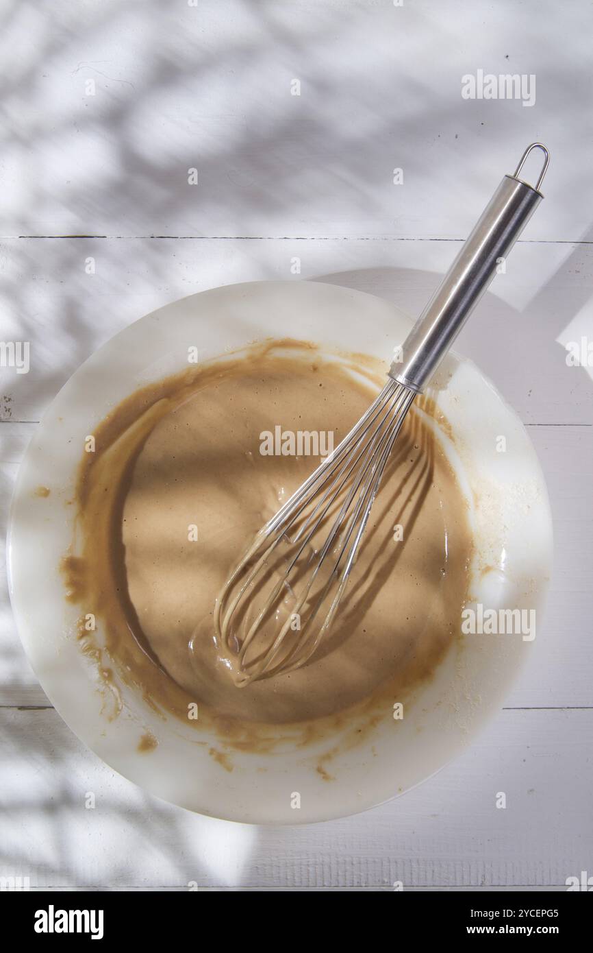 Whip for the preparation of the cream of chestnut flour Stock Photo - Alamy