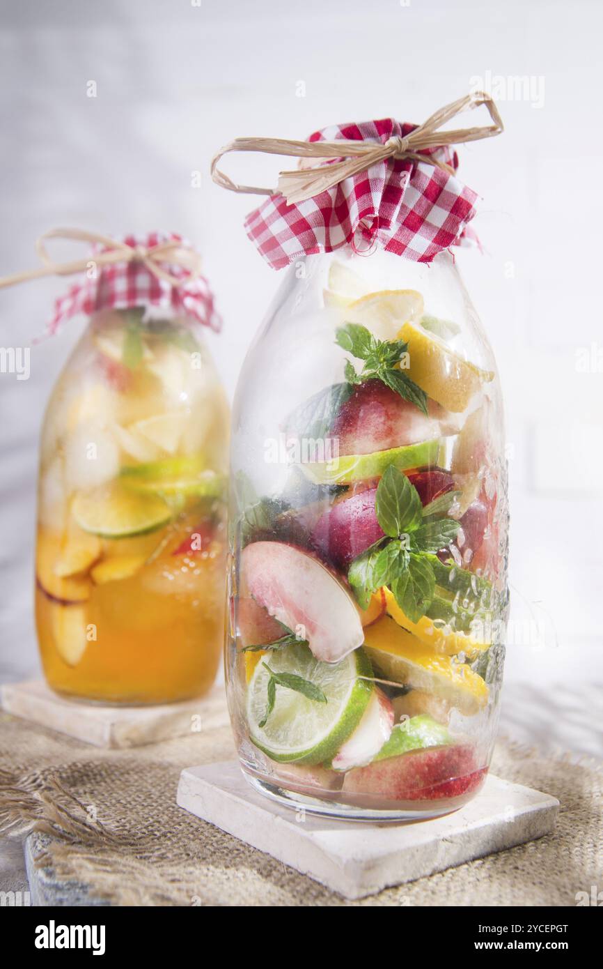 Bottle of infused fruit tea with peach and lemon Stock Photo - Alamy