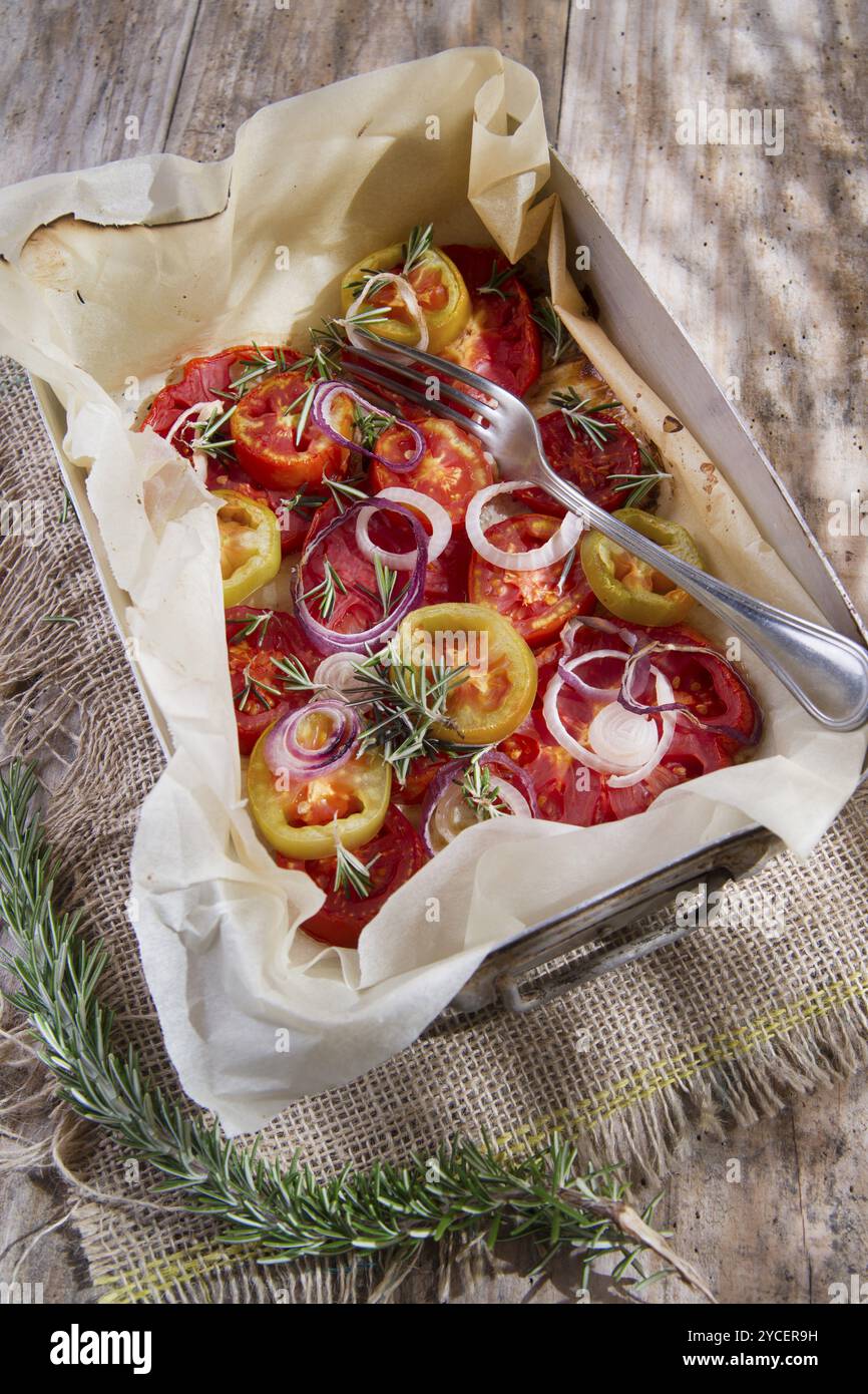 Presentation of a contour-based tomato slices baked with onions Stock ...