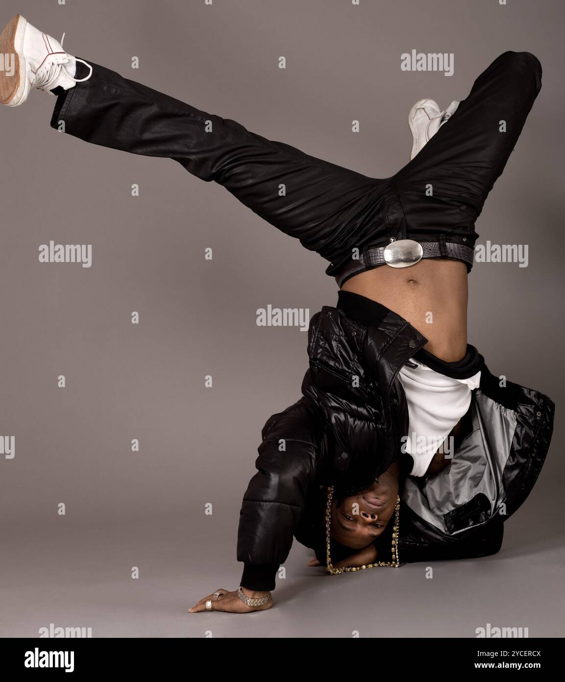 African american doing break dance on grey background Stock Photo - Alamy