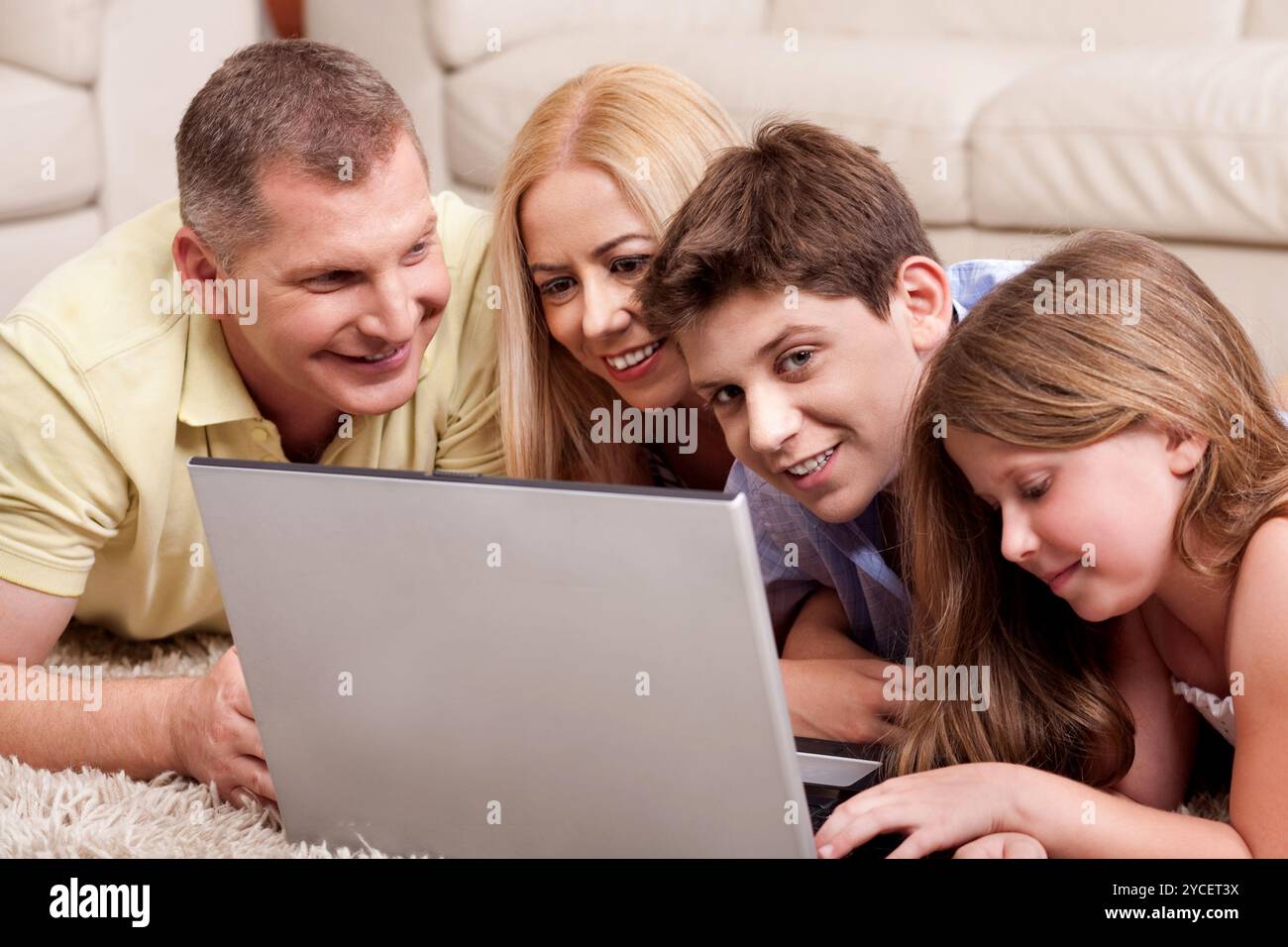 Portrait happy family laptop hi-res stock photography and images - Alamy