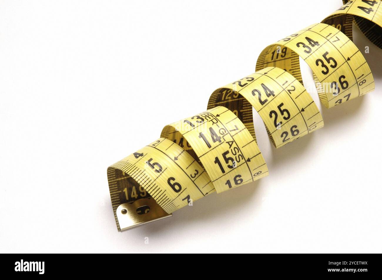 Measuring Tape rolled up on white background Stock Photo - Alamy