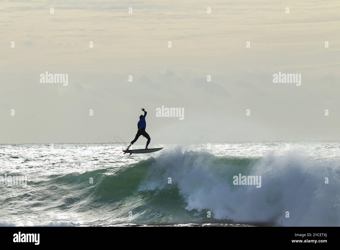 Majestic Jump on surfing board, Sunset and yellow sun rays draw figure ...