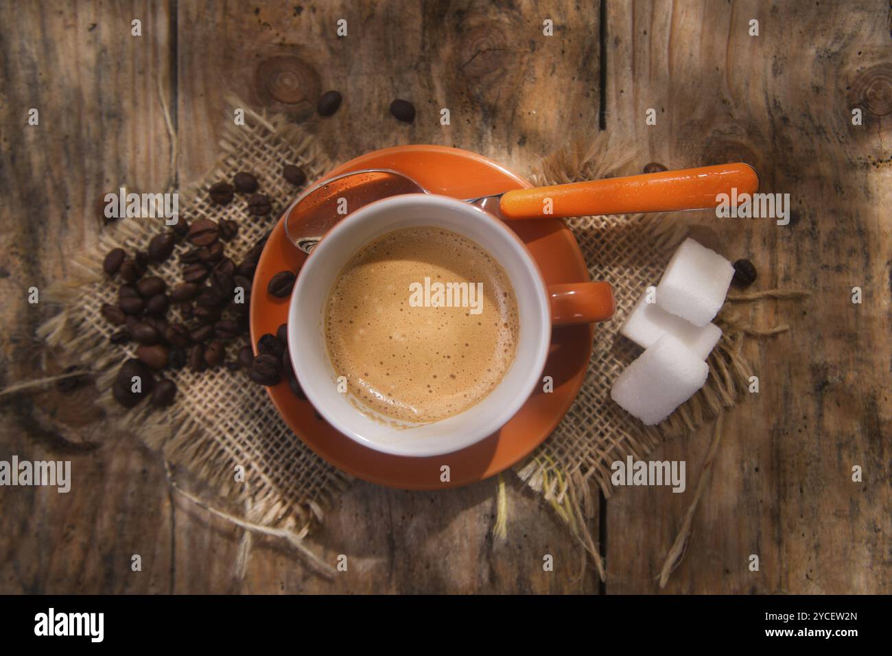 Presentation of a cup of hot coffee with coffee beans and sugar cubes ...