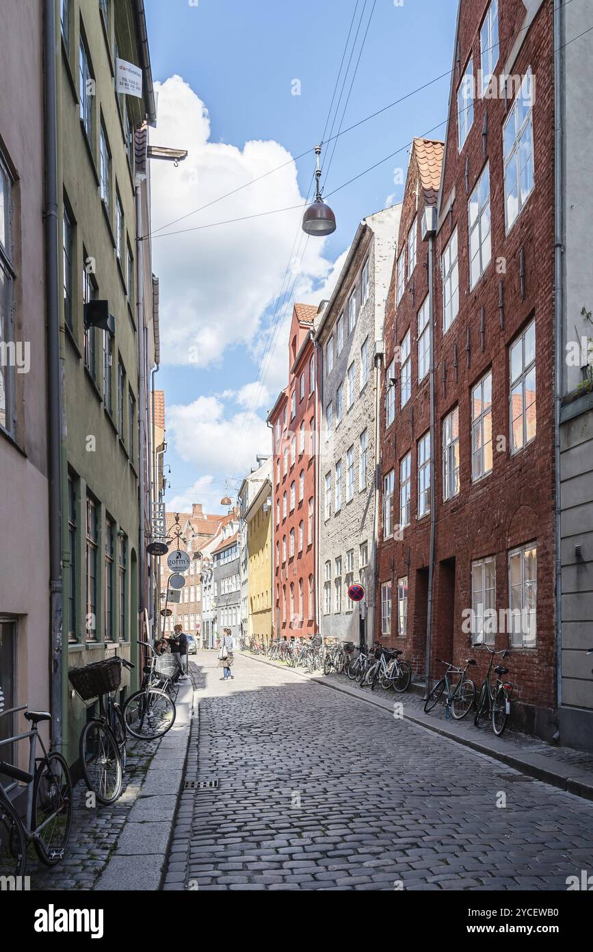 Copenhagen, Denmark, August 11, 2016. Beautiful street with cobblestone ...