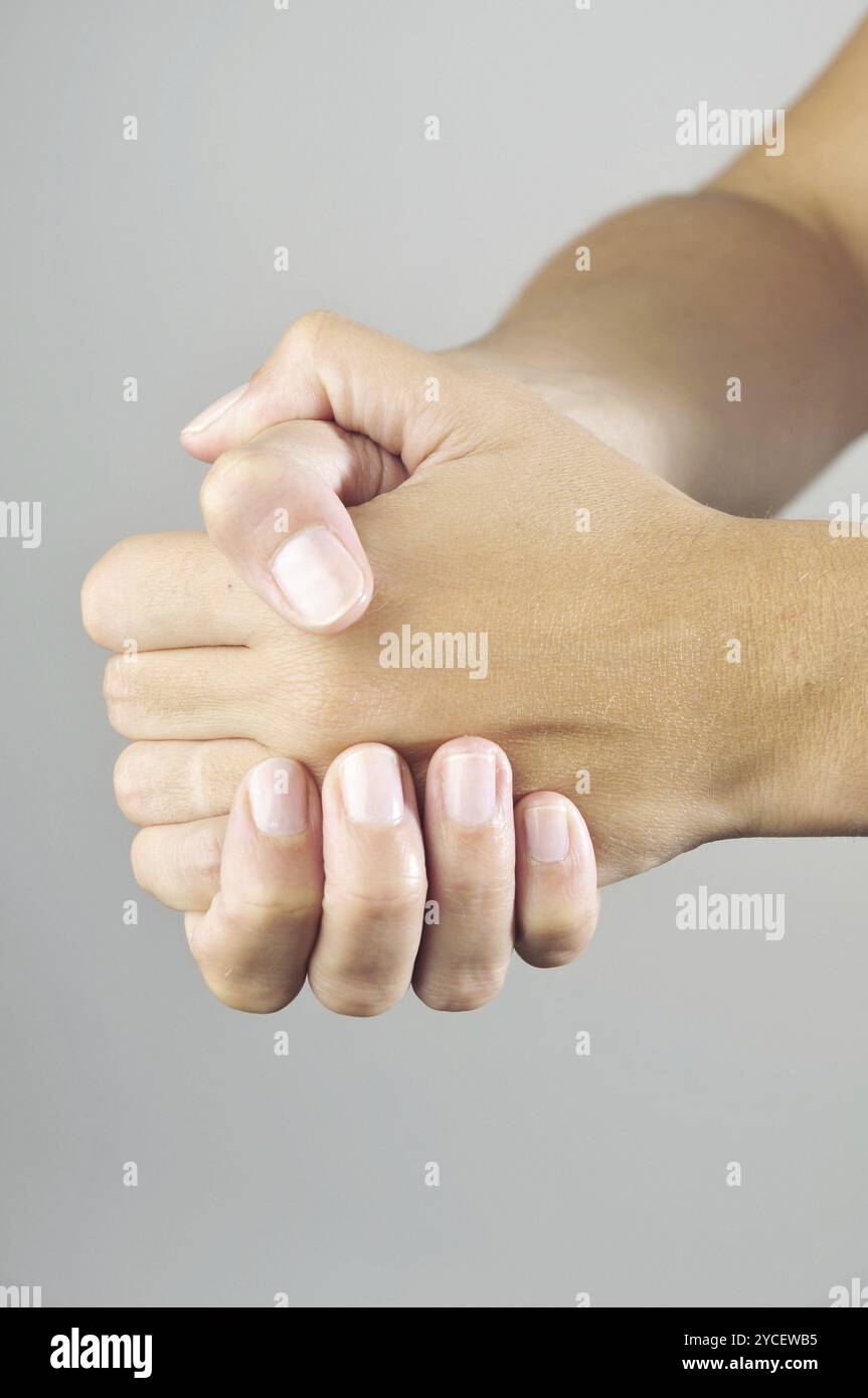 Hand Clasped on white background Stock Photo - Alamy