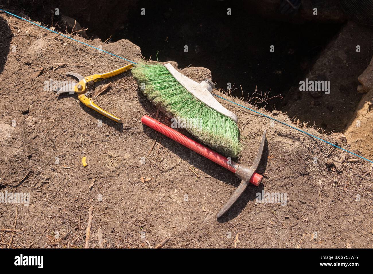 tools in an archaeological excavation, pruning shears, broom and ...