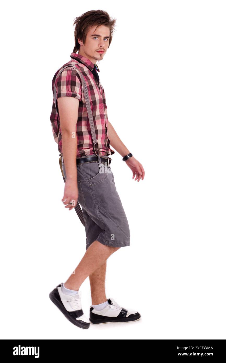 Casual handsome young guy in walking posture isolated on white ...