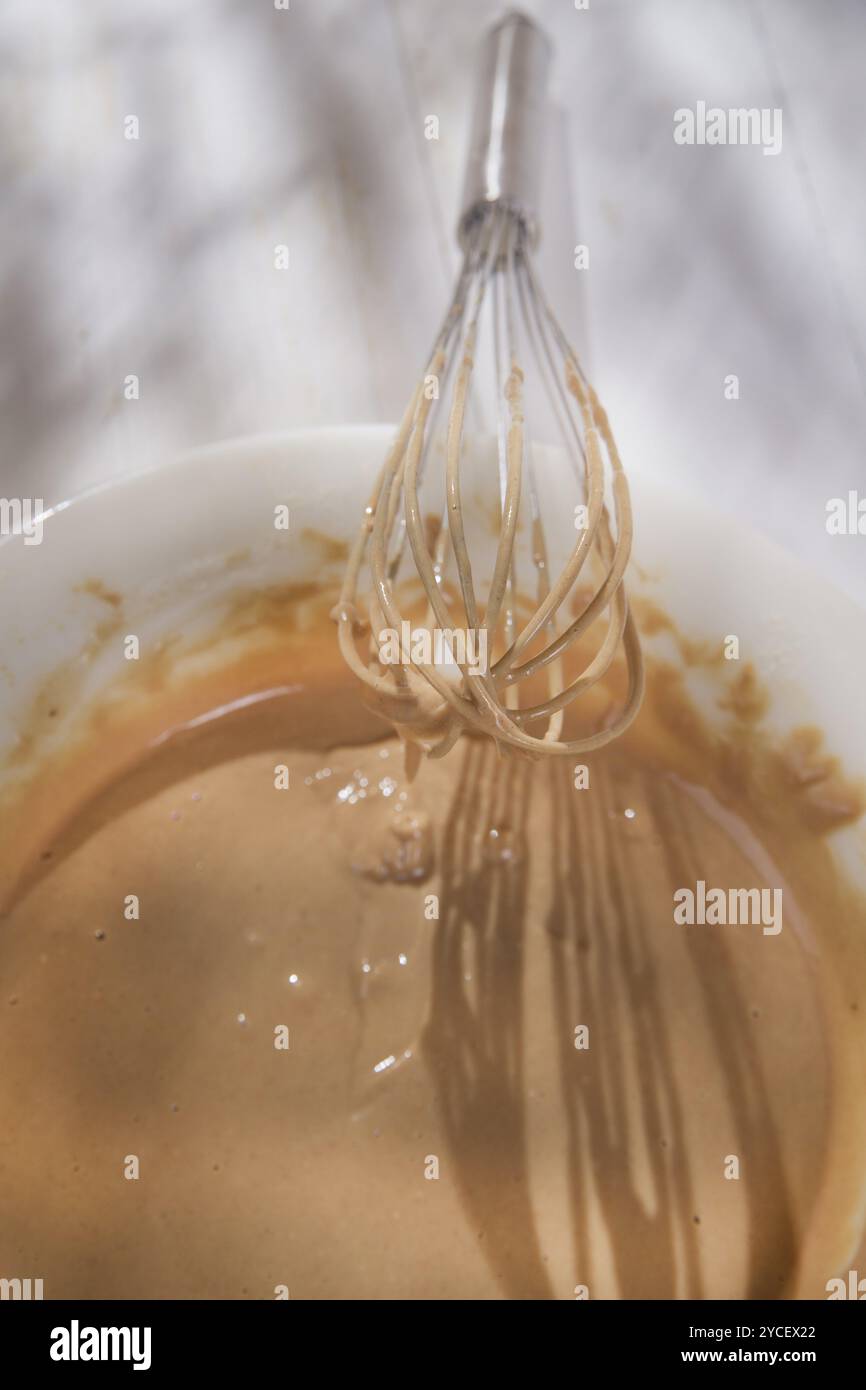 Whip for the preparation of the cream of chestnut flour Stock Photo - Alamy