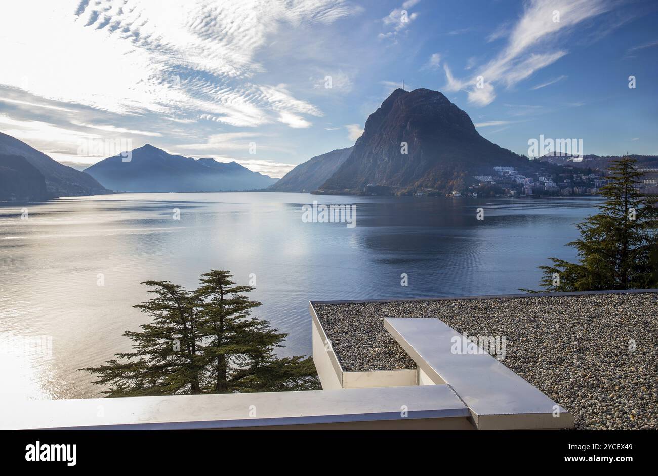 Sunny view of Lake Lugano and nice residential buildings on the shore ...
