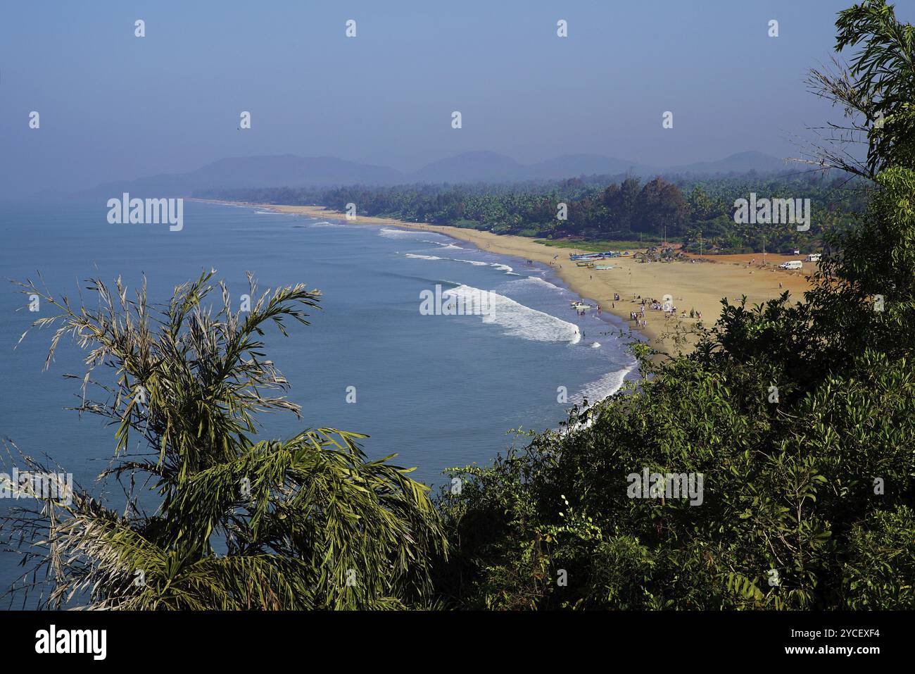 Beach in Goa or Karnataka, Indian people swimming in clothes swimming ...