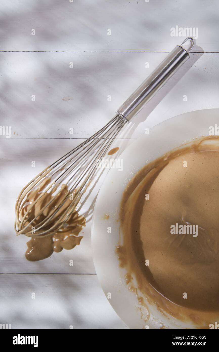 Whip for the preparation of the cream of chestnut flour Stock Photo - Alamy