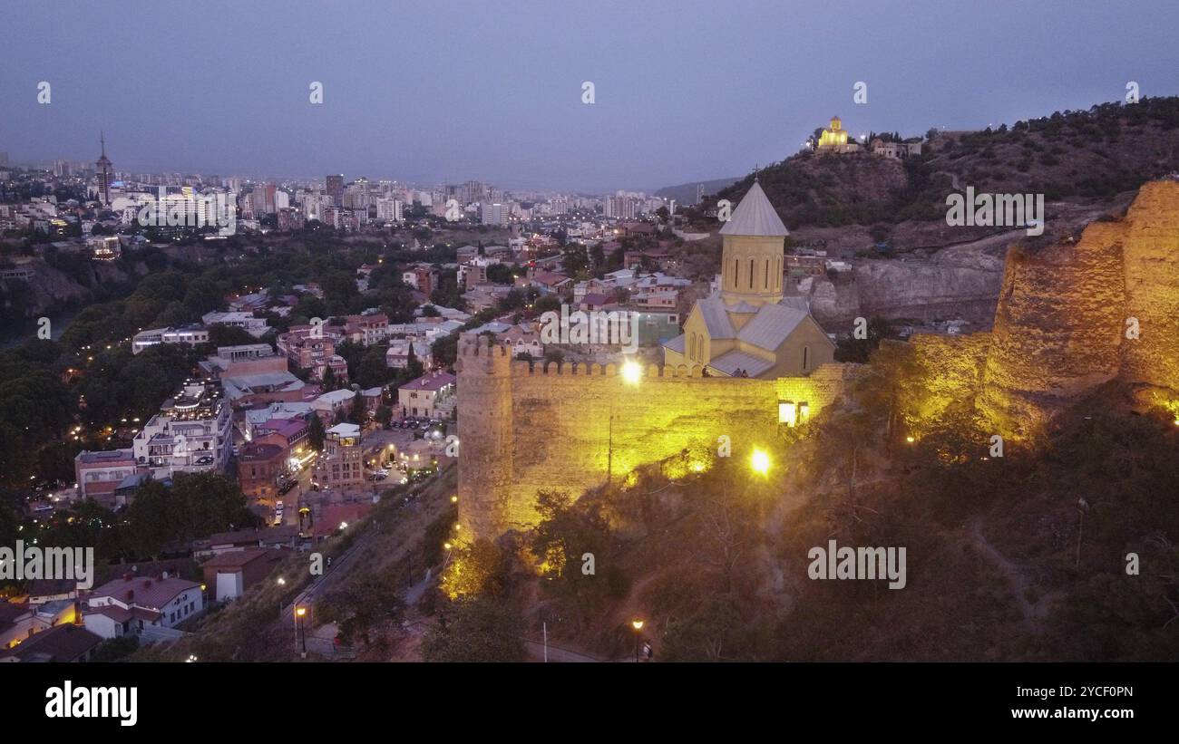 Amazing evening view of old Tbilisi: Narikala fort and church inside of ...