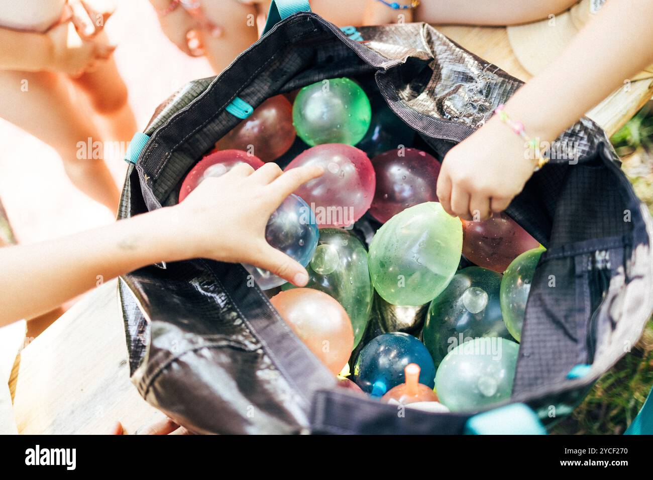 Children with water bombs Stock Photo - Alamy