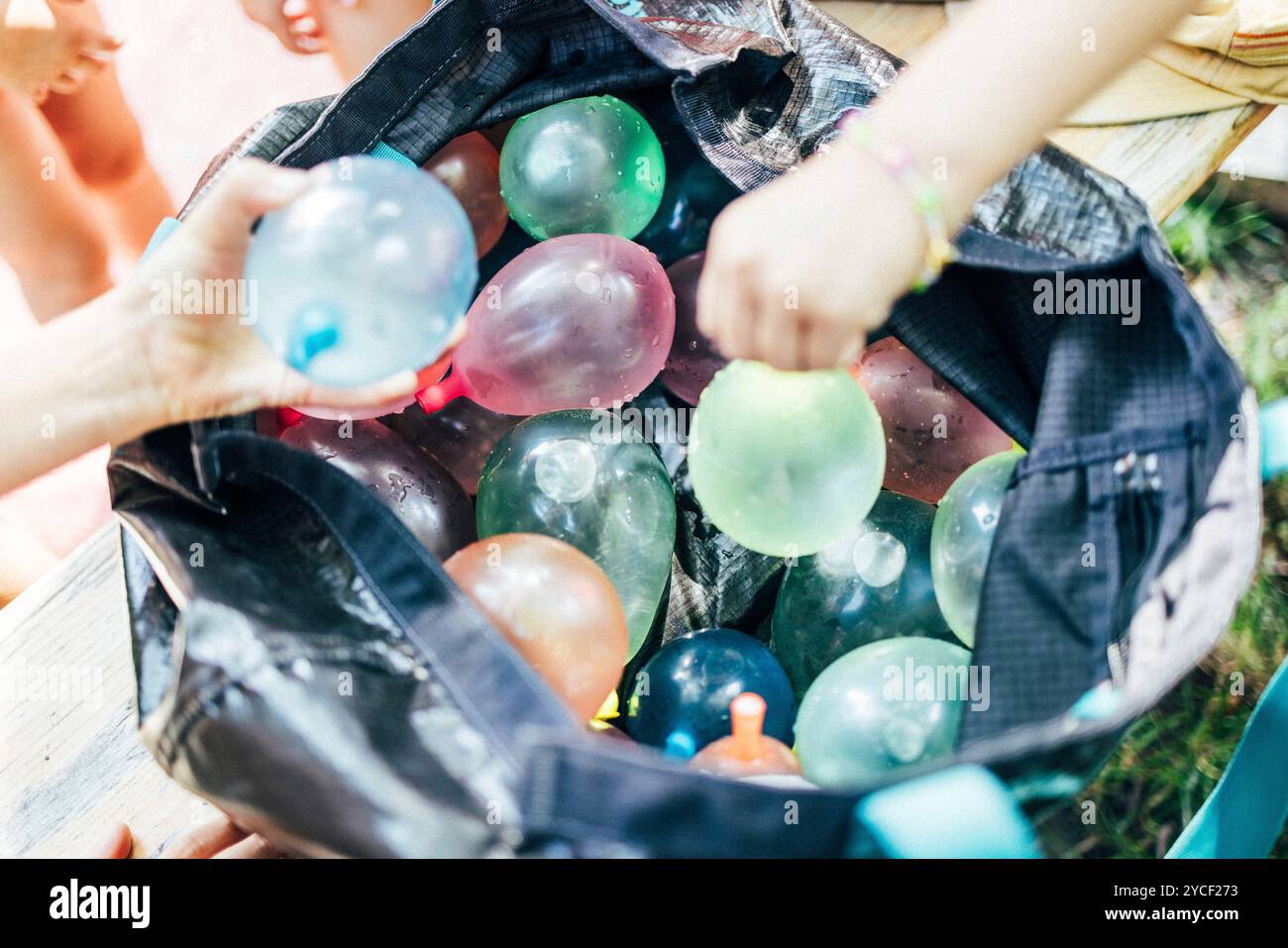Children with water bombs Stock Photo - Alamy