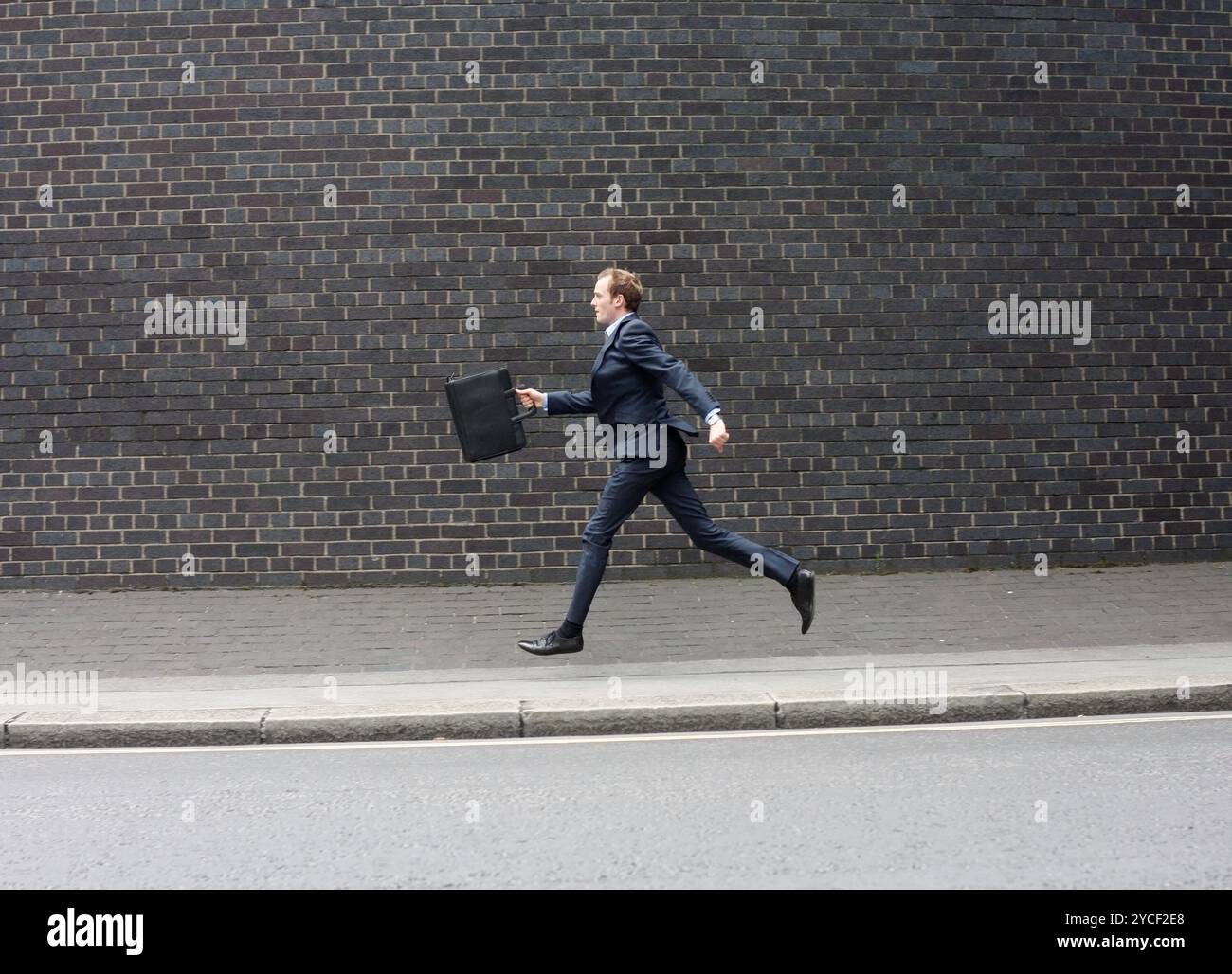 Business man running Stock Photo - Alamy