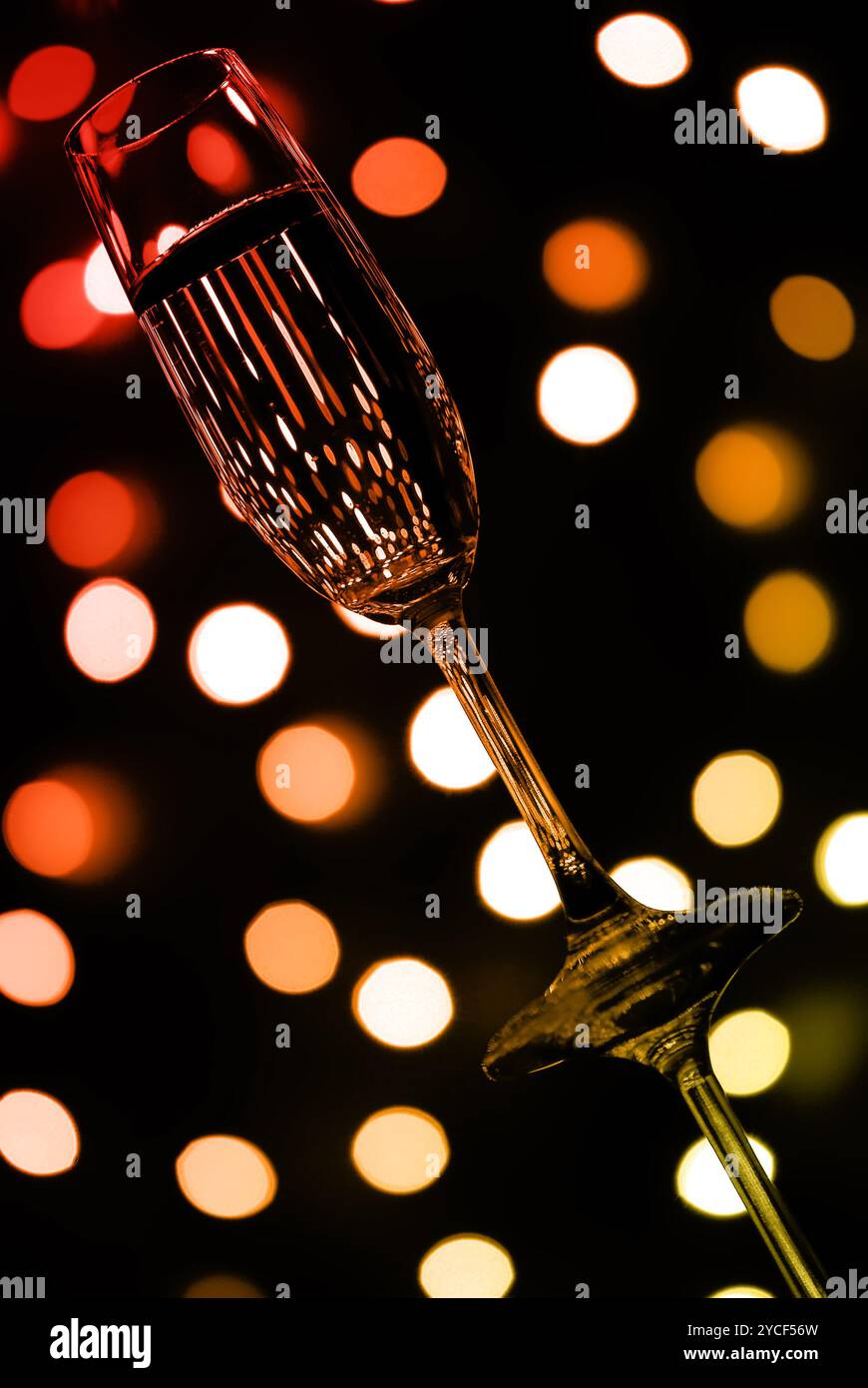 abstract composition: colored champagne glass over lights background ...