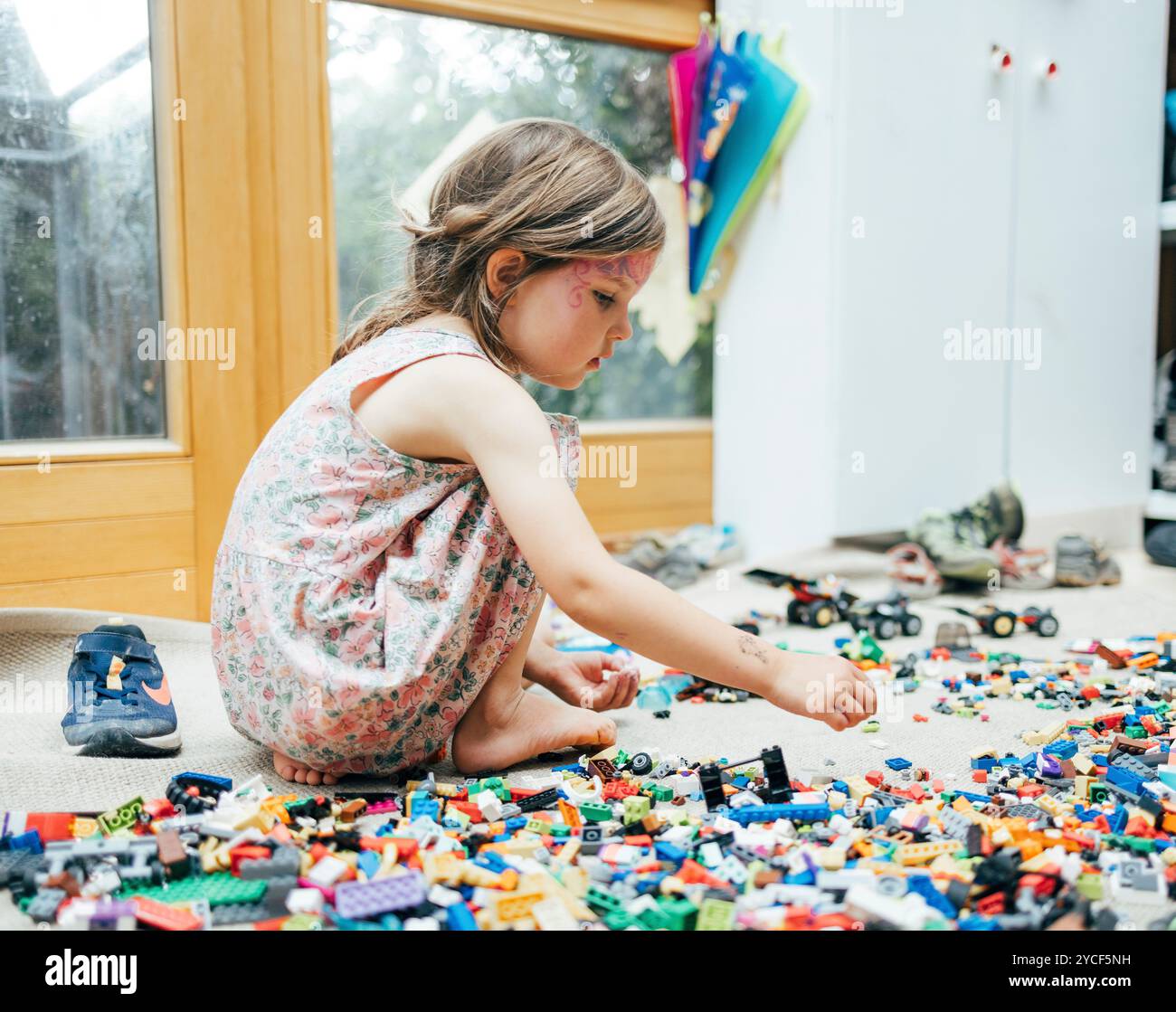 Girl playing with lego hi-res stock photography and images - Alamy