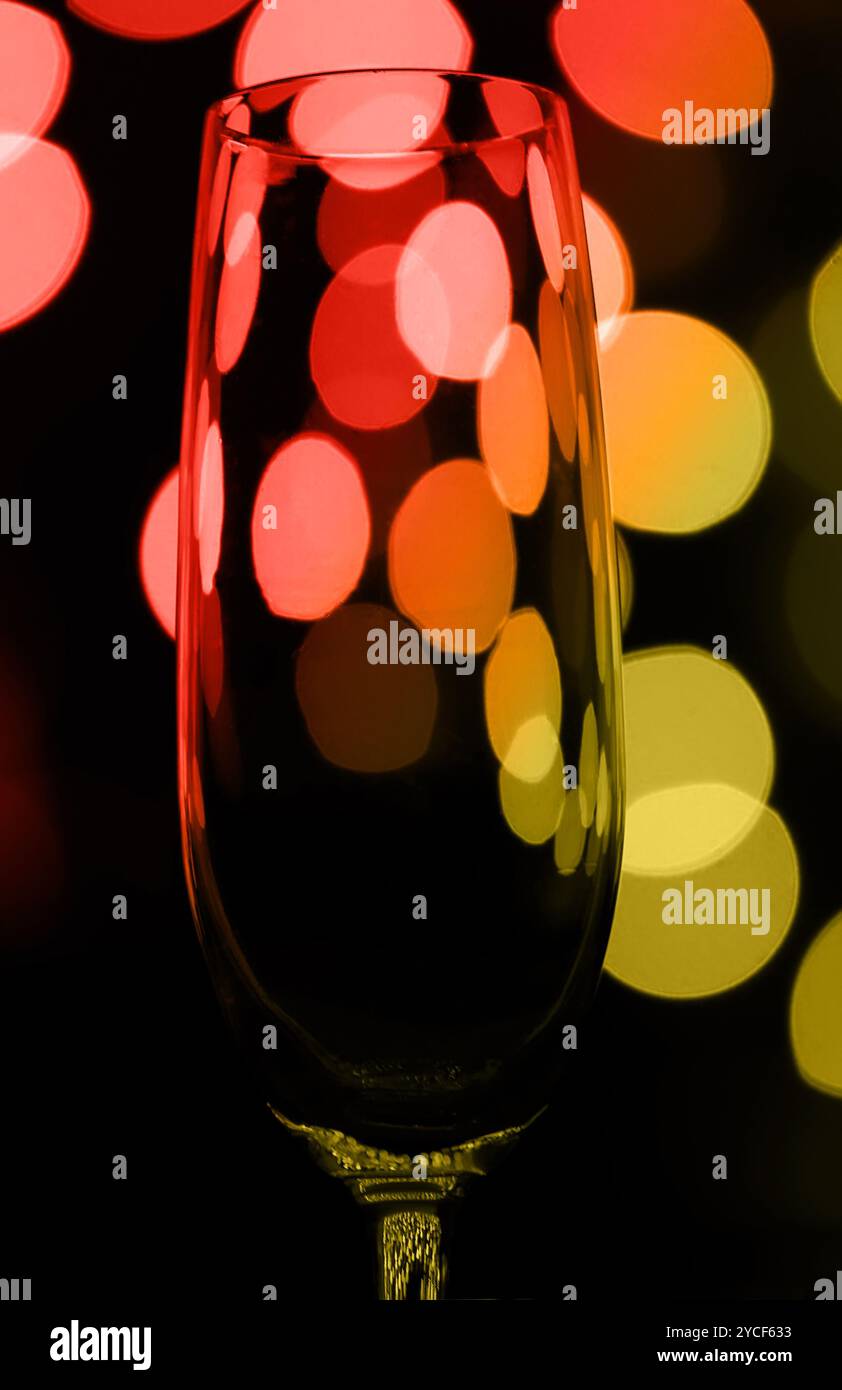 abstract composition: colored champagne glass over lights background ...