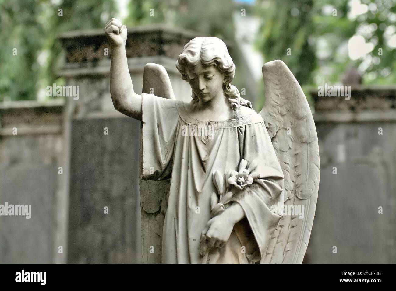 Statue of a grieving angel figure at Taman Prasasti museum (museum of ...