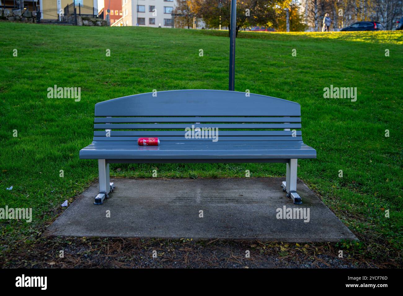 Park bench and empty beer can in Kajaani Stock Photo - Alamy