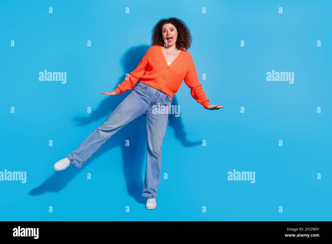 Photo portrait of young latin funny lady with curly hairstyle in orange ...