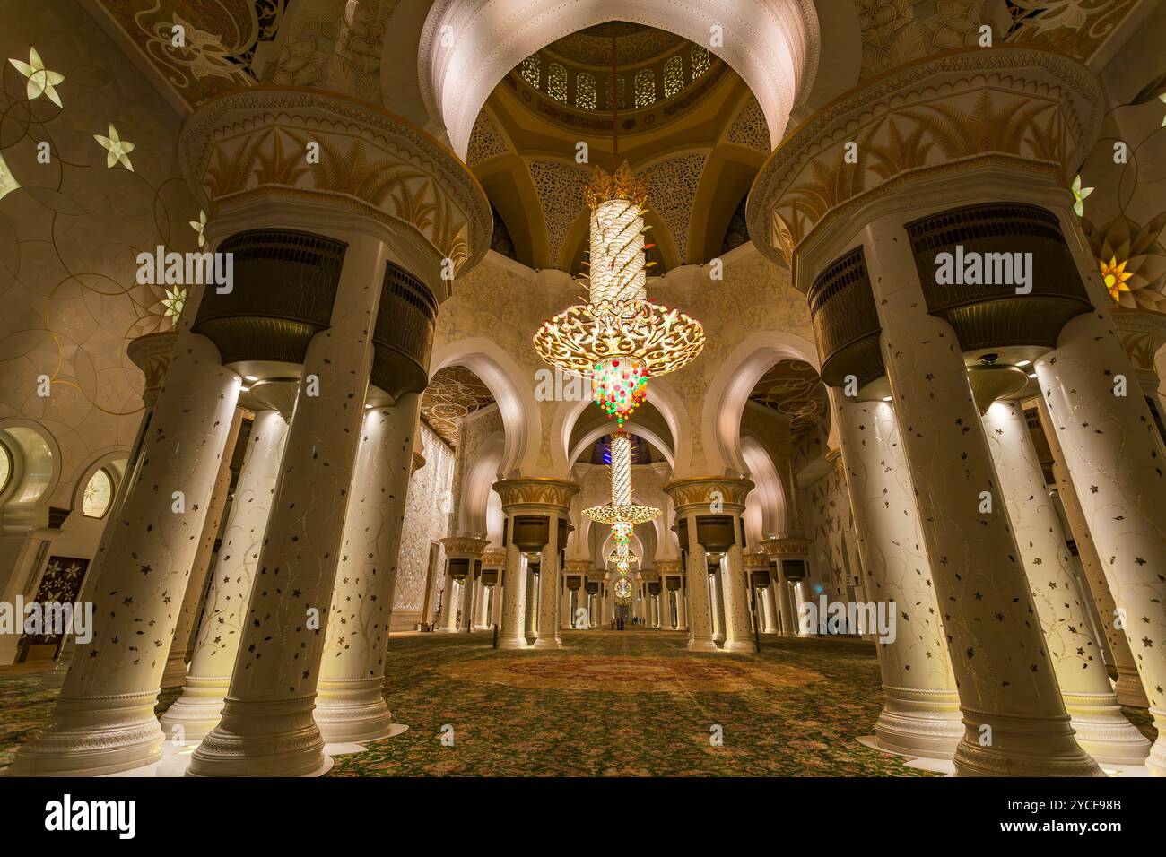 Prayer hall, interior with chandelier, evening lighting, largest hand ...