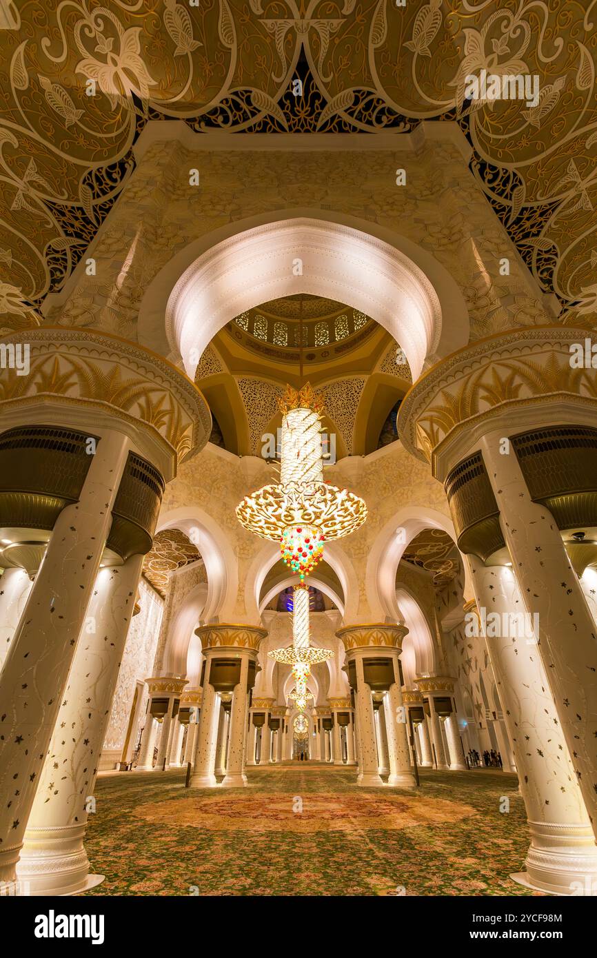 Prayer hall, interior with chandelier, evening lighting, largest hand ...