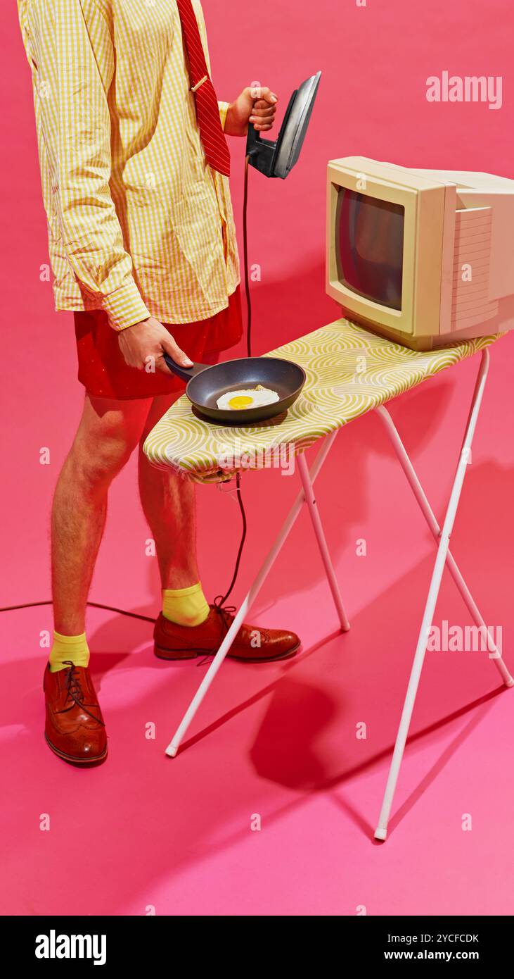 Retro-styled man with iron and vintage computer, this humorous take on ...