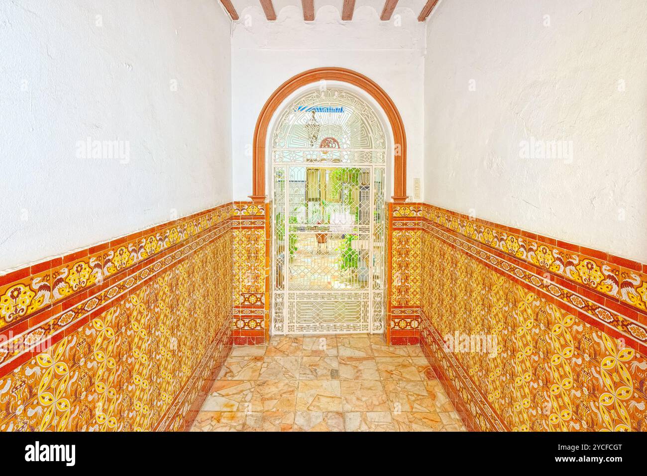 Main entrance (porch) to the ancient Seville houses. Spain Stock Photo ...