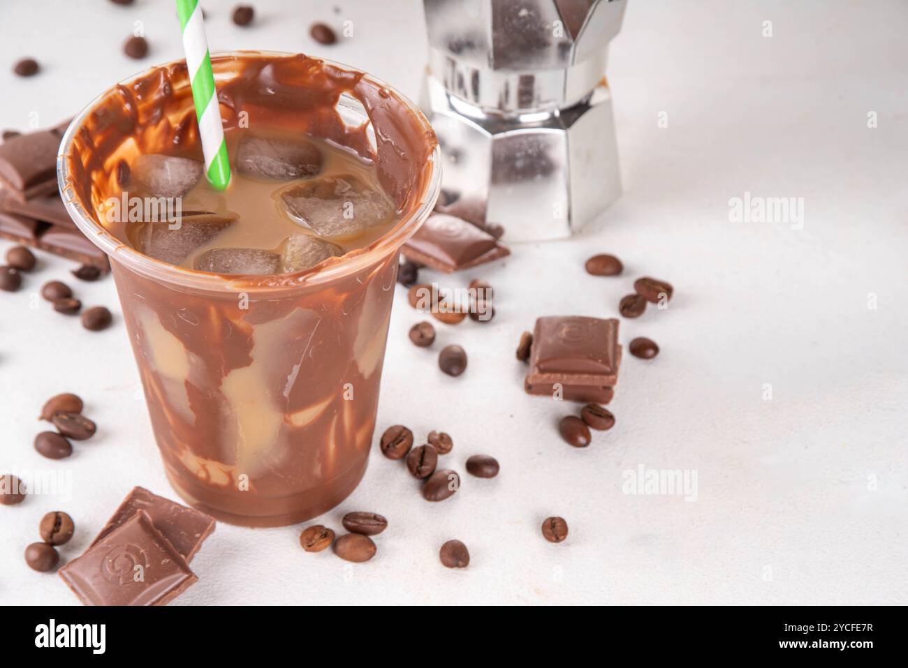 Viral Cracking Chocolate Latte drink. Plastic glass with cracked milk ...