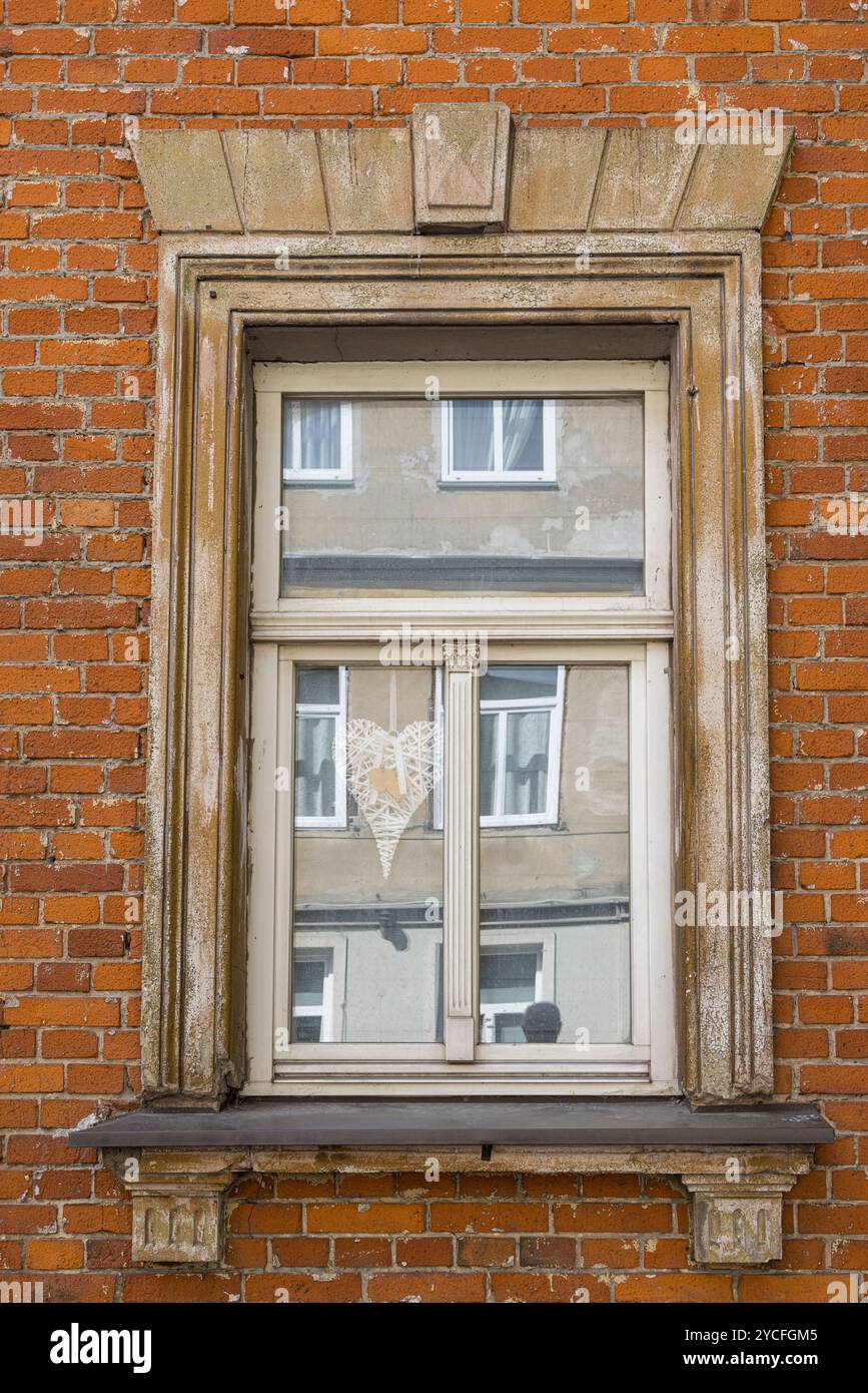 Old window with reflection of the windows of building opposite hi-res ...